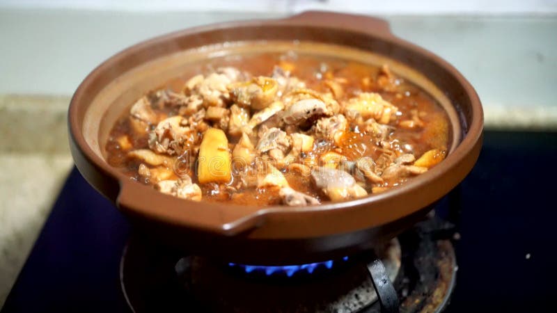 Three Cups of Chicken are Being Cooked in a Casserole in a Chinese Home ...