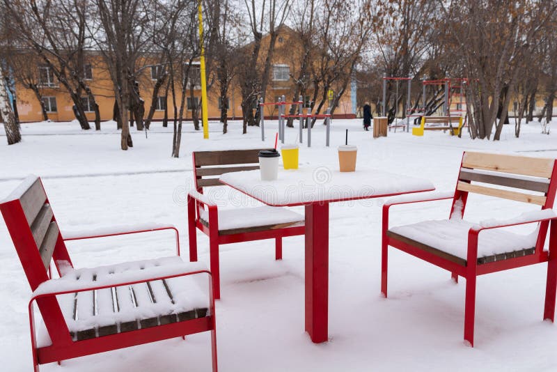 Three Cups of Coffee are on a Snow-covered Table in a Winter Park Stock ...