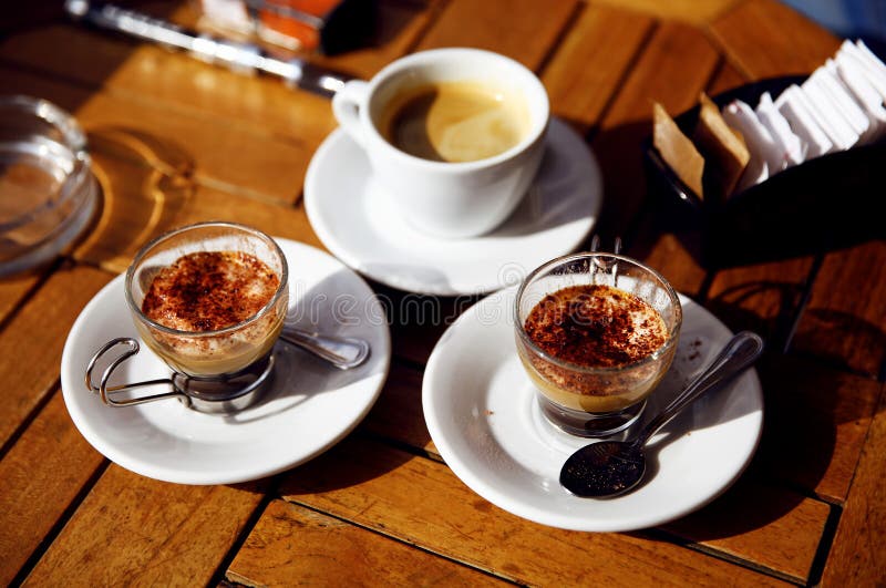 Three Cups of Coffee on a Wooden Table Stock Image - Image of ...