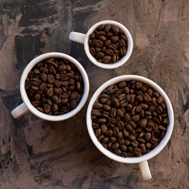 Three Cups are Filled with Roasted Coffee Beans. Flat Lay Stock Image ...