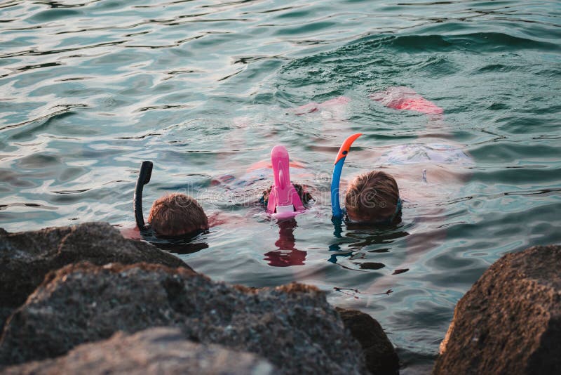 Three Curious Divers on the Sea Shore Stock Image - Image of boating ...