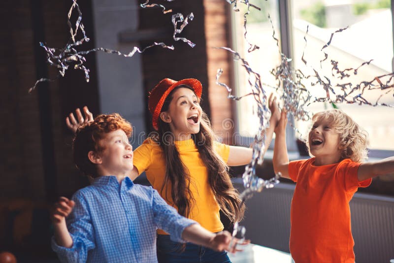 Three Cute Kids Studying in the Classroom and Looking Involved Stock ...