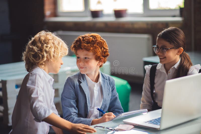 Three Cute Kids Discussing Something and Looking Excited Stock Image ...