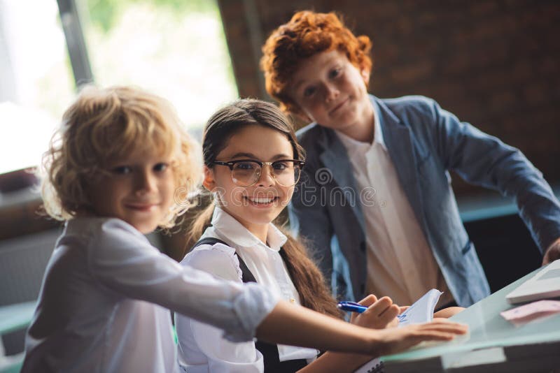 Three Cute Kids Studying in the Classroom and Feeling Excited Stock ...