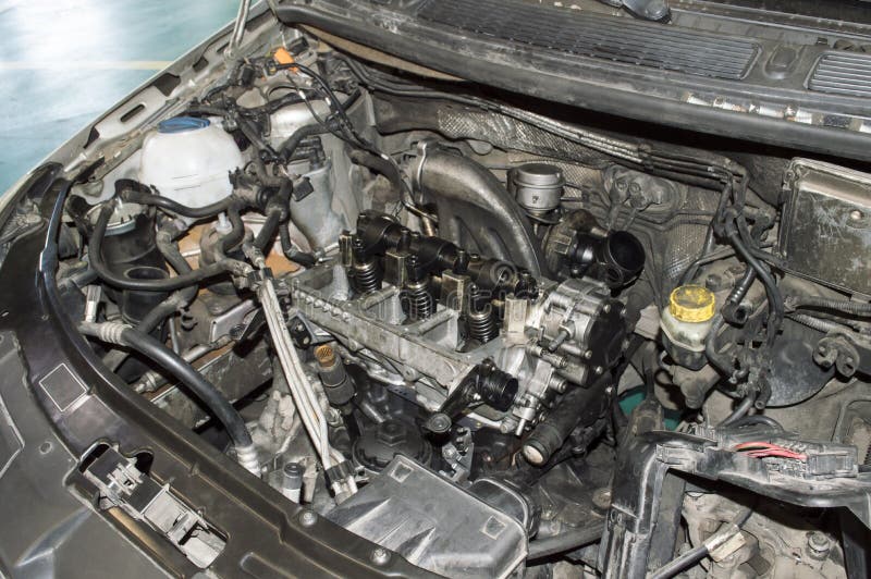 Three-cylinder Engine with the Valve Cover Removed Under the Hood of ...