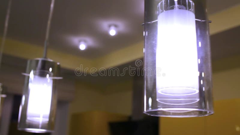 Three Cylindrical Shaped Lamp Hanging from Ceiling Stock Video - Video ...