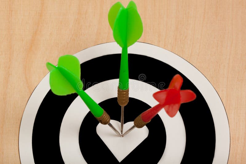 Three darts hit the target stock image. Image of target - 13259367