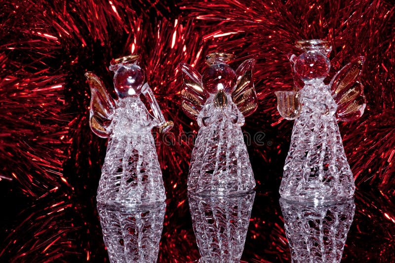 Three Decorative Glass Angels on Stock Image - Image of reflection ...