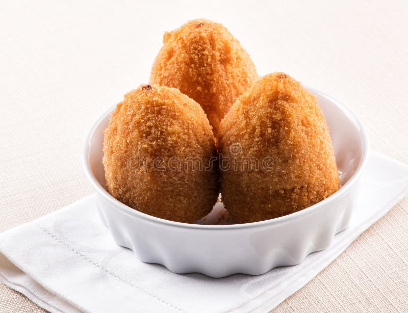 Three Deep Fried Arancini from Sicily in a Bowl Stock Photo - Image of ...