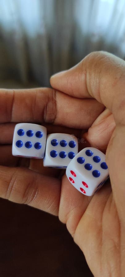 Three Dice (Latin: Datum) in Hand. Dice are Cube-shaped Game Tools ...