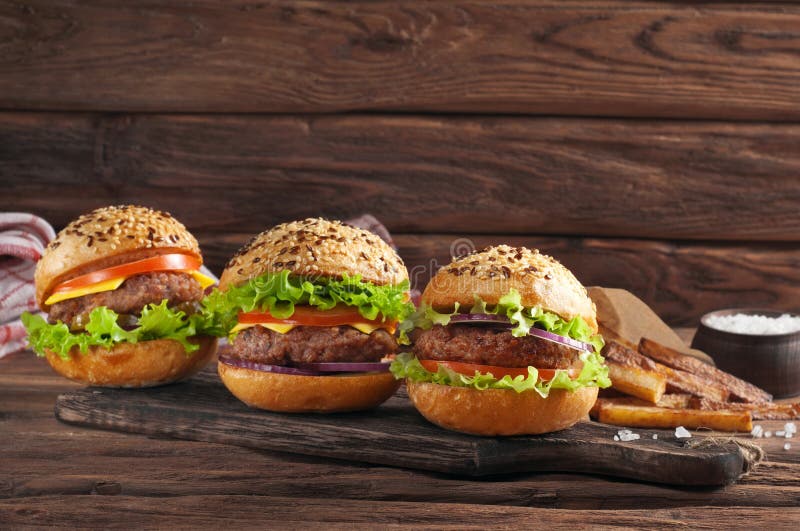 Three Different Burger on Wooden Board Stock Photo - Image of hamburger ...