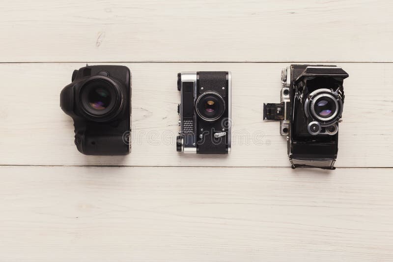 Three Different Cameras on White Table Stock Photo - Image of hobby ...