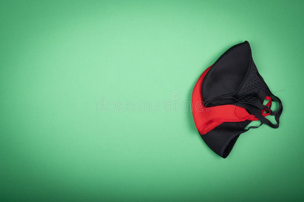 Three Different Face Masks on a Green Surface Stock Photo - Image of ...