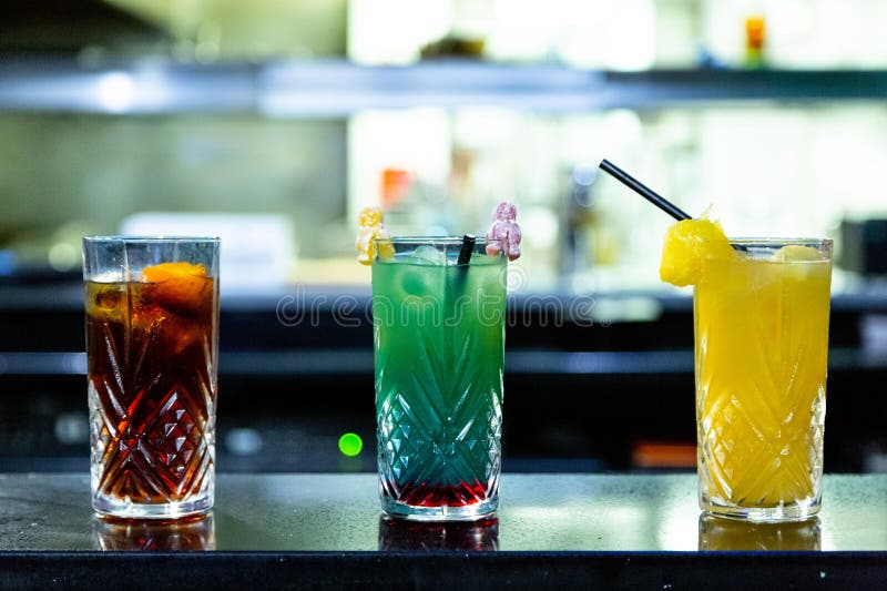 Three Different Cocktails. Coke Cocktail, Blue Cocktail and Yellow ...