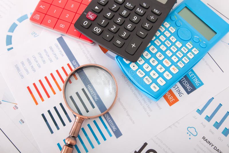 Three Different Color Calculators and a Magnifying Glass on the ...