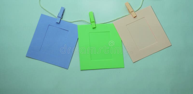 Three Different Colored Paper Frames Hanging on Rope Stock Image ...