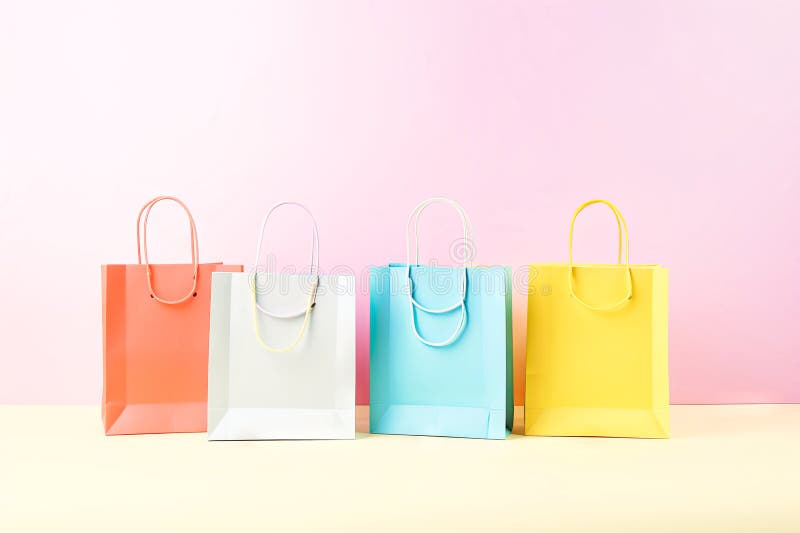 Three Different Colored Shopping Bags on a Table Stock Photo - Image of ...