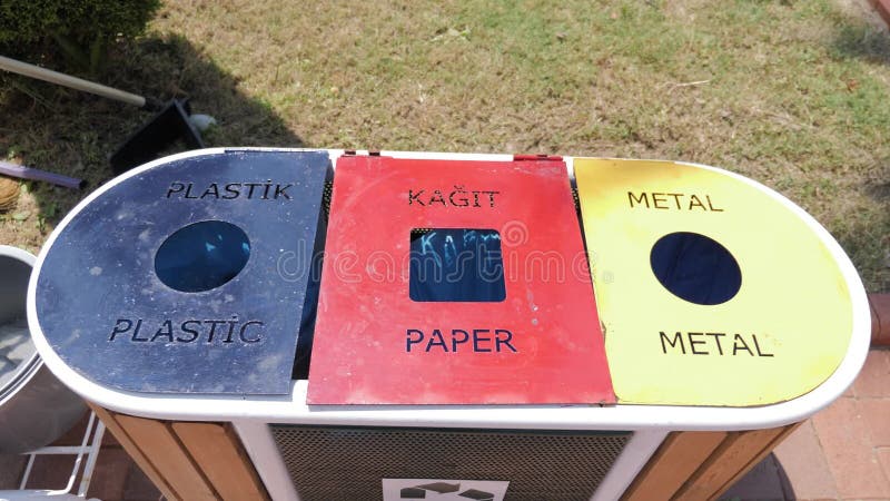 Colorful Recycling Bins Lined Up on a City Street, Showcasing Waste ...