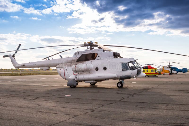 Three Different Helicopters at the Helipad Stock Photo - Image of ...