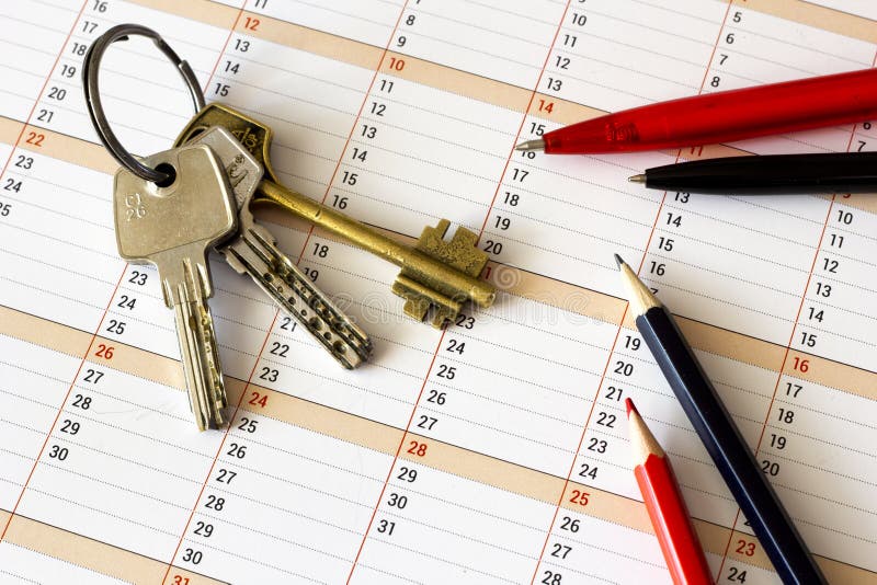 Three Different Keys on a Calendar and Pens Top View Stock Photo ...