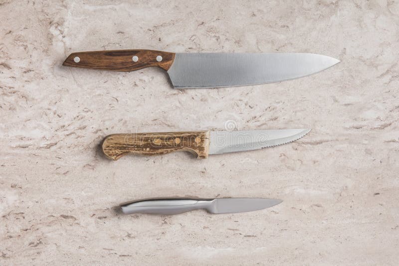 Three Different Knifes on Marble Tabletop Stock Photo - Image of ...