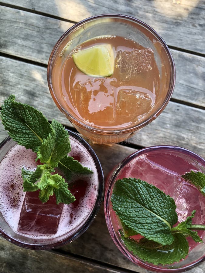 Three Different Lemonade Standing on a Table. Stock Image - Image of ...