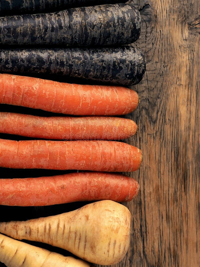 Three Different Root Vegetables on a Rustic Wooden Table Stock Image ...