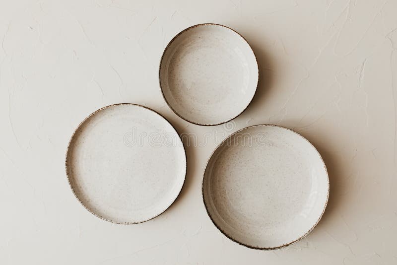 Three Different Size Beige Plate on Beige Background Stock Photo ...