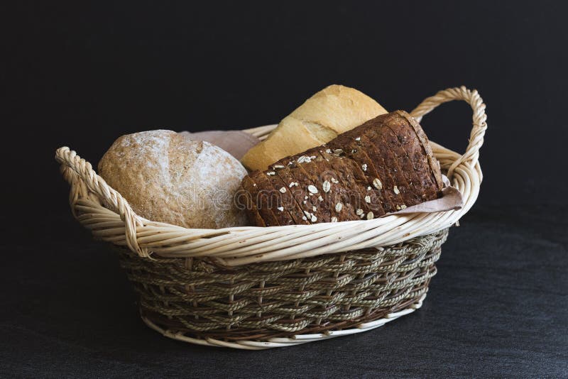 Three Different Types of Bread in a Wicker Basket. Stock Image - Image ...
