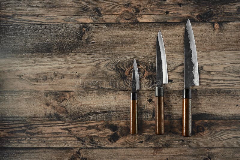 Three Kitchen Knives Arranged on a Rustic Wooden Surface in Natural ...