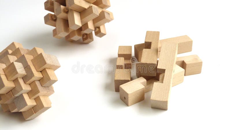 Three-Dimensional Wooden Puzzles on a White Background Stock Photo ...