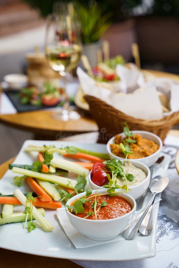 Three Dip Sauces with Vegetables on a Plate at Brunch Table Stock Image ...