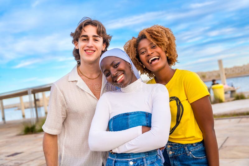 Three Diverse Friends Posing Looking at Camera and Smiling Stock Photo ...