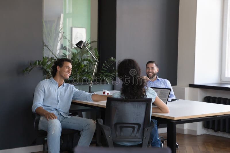 Three Diverse Office Employees Joking Talking during Break at Workplace ...