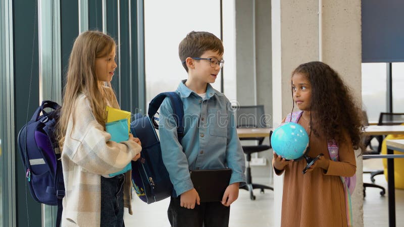 Three Diverse Pupils Communicate in the Class after the Lesson Stock ...