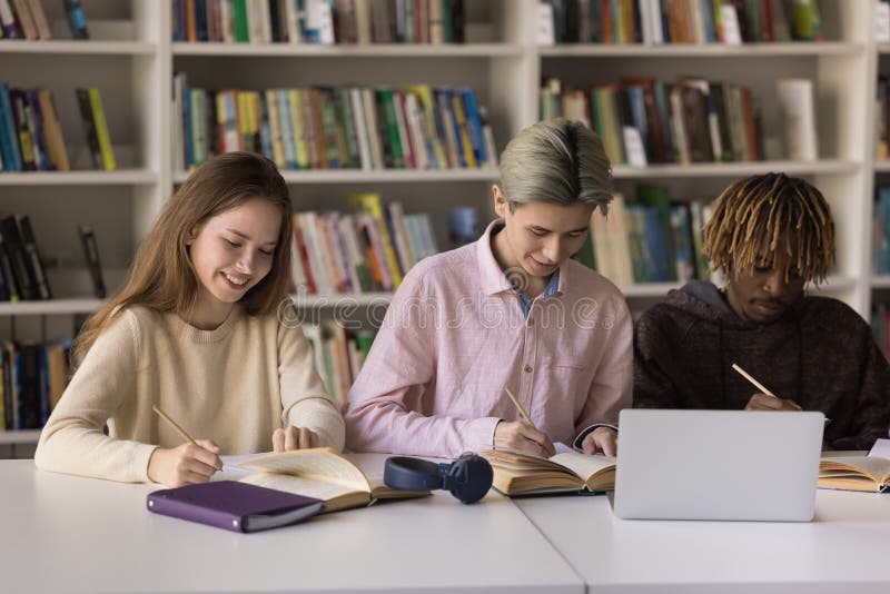 Three Diverse Students Sit Library with Laptop Do Homework Stock Image ...