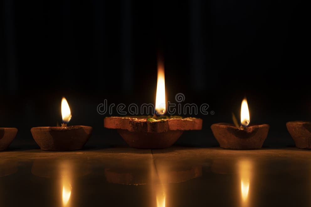 Three Diyas Kept in a Row, Celebrating Diwali in India Stock Photo ...