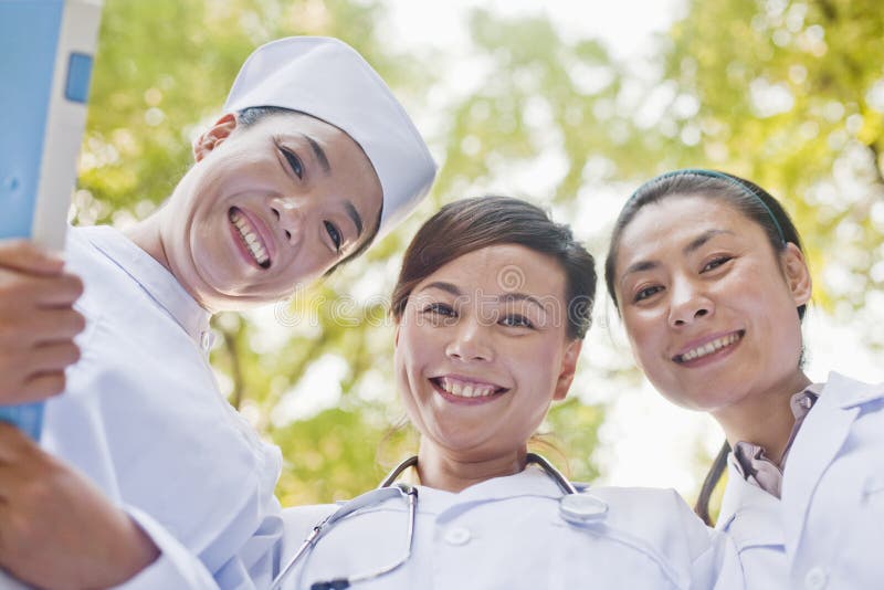 Three Healthcare Workers, Portrait Stock Photo - Image of camera ...