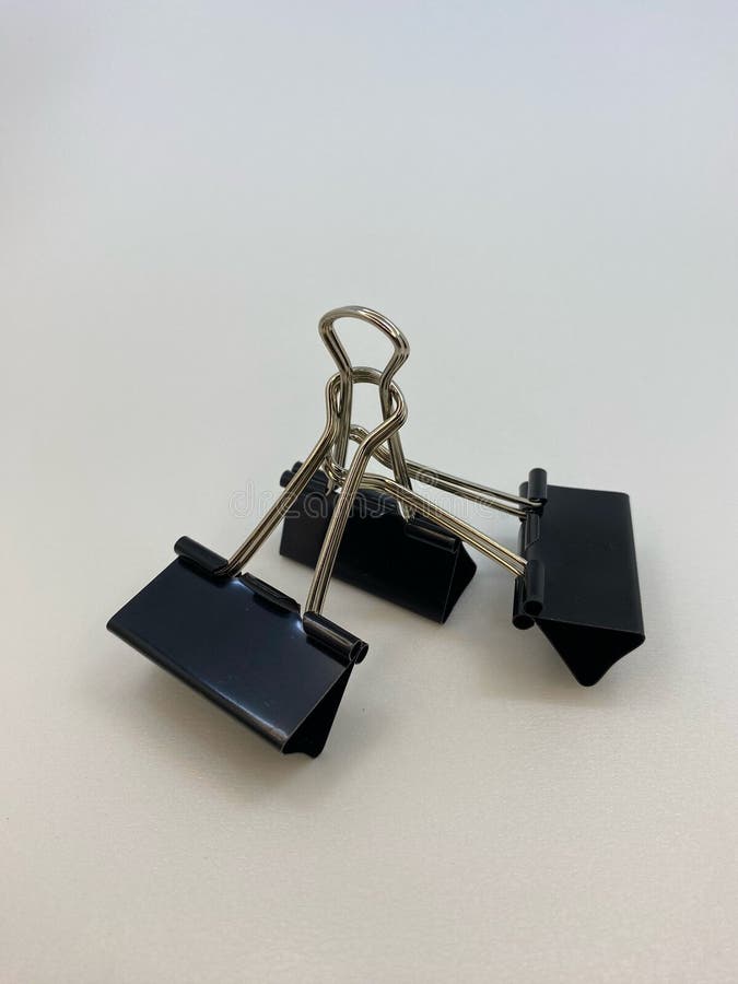 Three Document Clips in an Isolated Room Stock Photo - Image of studio ...