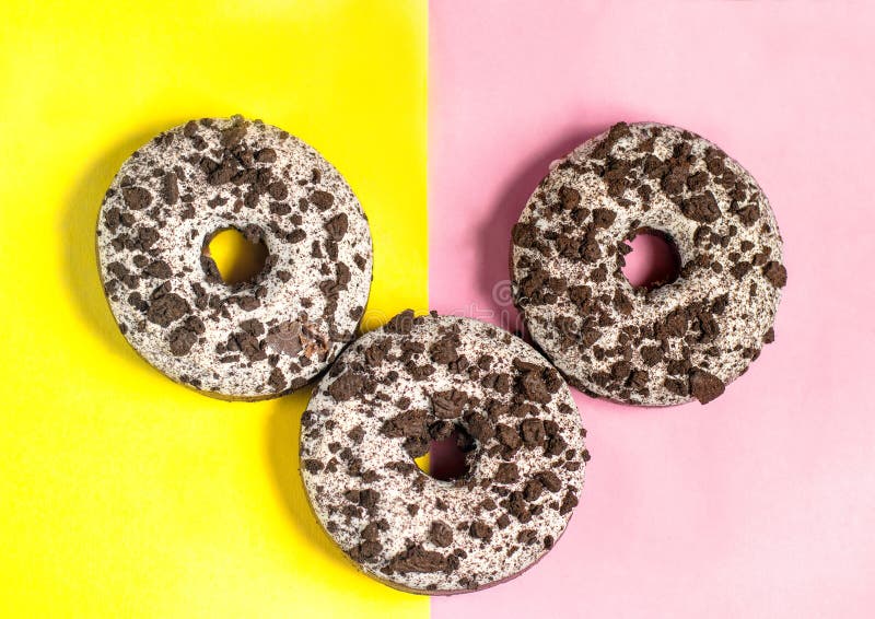 Three Donuts on a Split Colored Background Stock Image - Image of ...