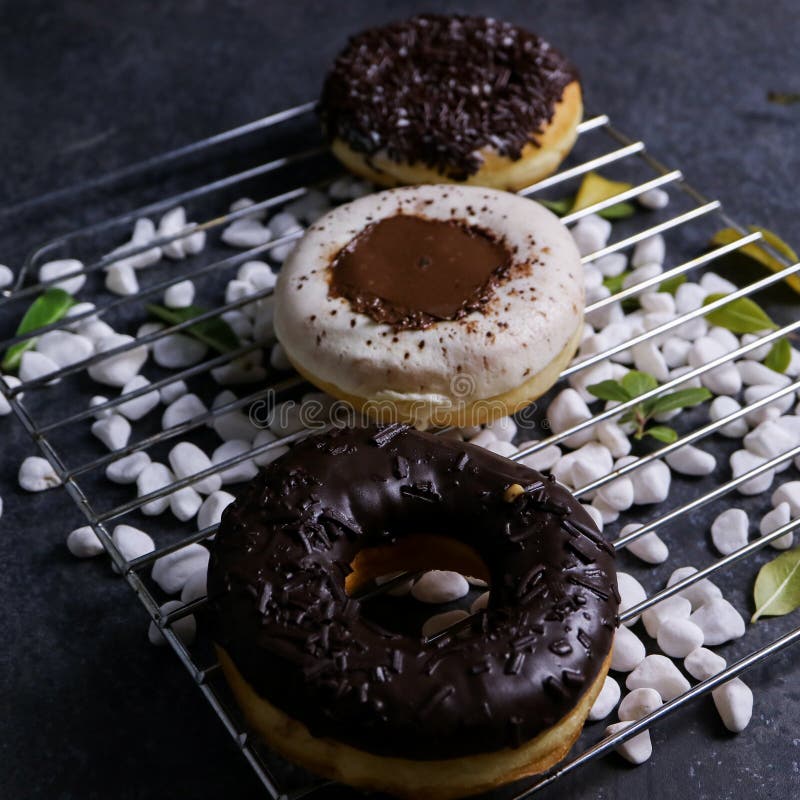 Triple Sweet Chocolate Donuts on Tray Stock Image - Image of stack ...