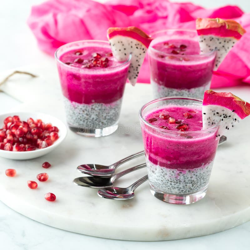 Three Dragonfruit Chia Pudding Parfaits, Garnished with Pomegranate ...