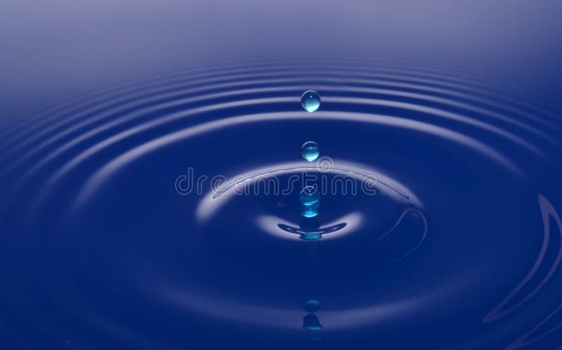 Three Drops on a Red Background and a Silver Liquid Similar To Mercury ...