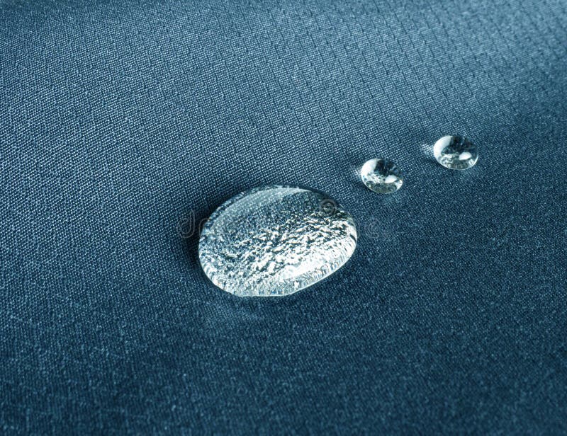 Three Drops on Technological Waterproof and Breathable Fabric Close-up ...