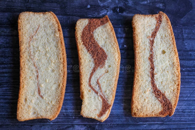 Three Dry Sponge Cakes on a Black Board Stock Photo - Image of cake ...