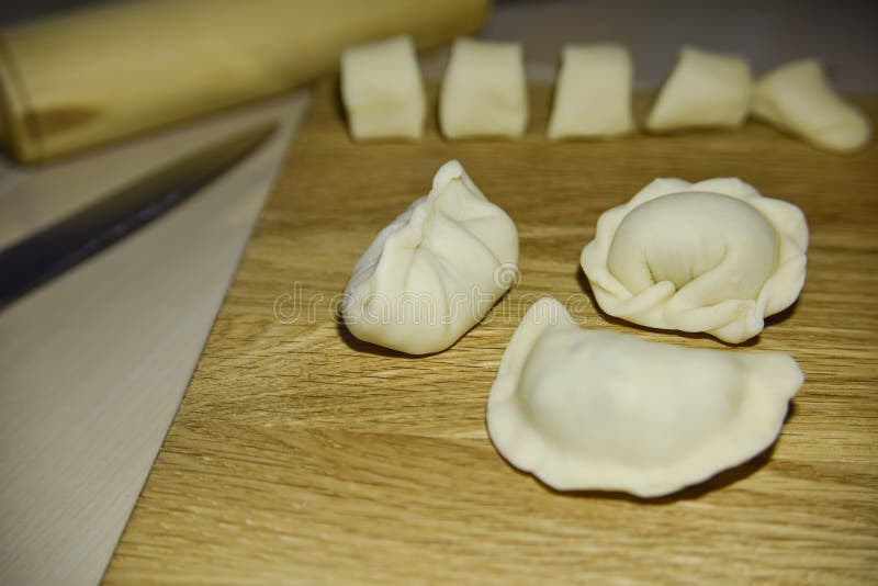 Three Dumplings of Different Shape on the Wooden Deck Stock Image ...