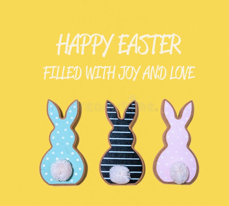 Three Easter Bunnies with a Yellow Background Stock Image - Image of ...