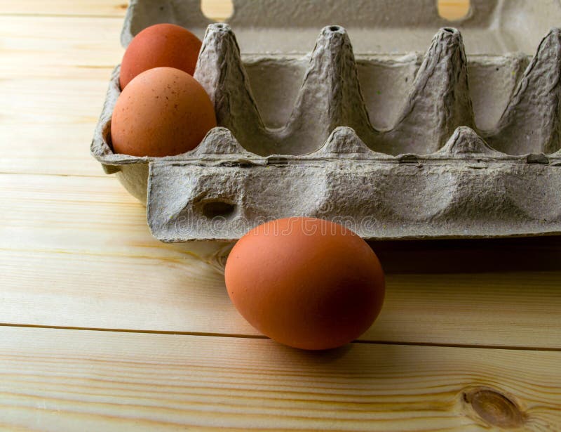 Three eggs in a carton stock photo. Image of freshness - 271505946