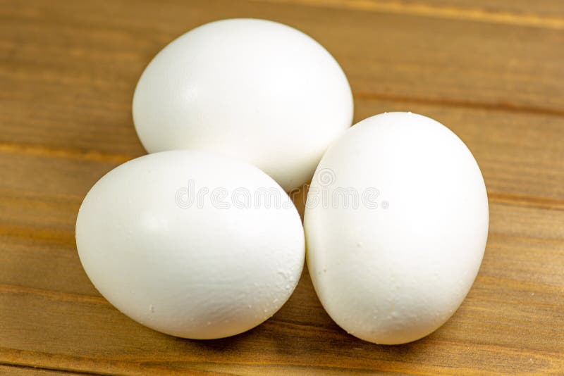 Three Eggs on the Kitchen Table Ready for Frying Stock Photo - Image of ...