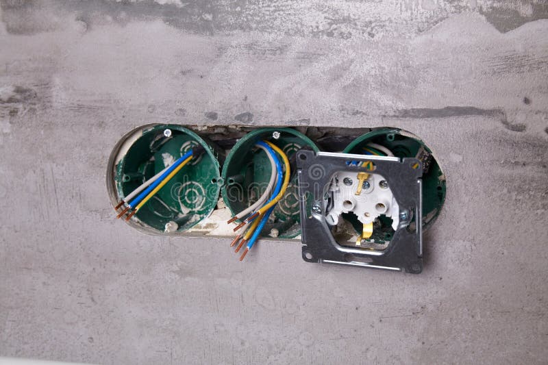 Three Electrical Boxes for Conduits are Built into the Wall. Work on ...